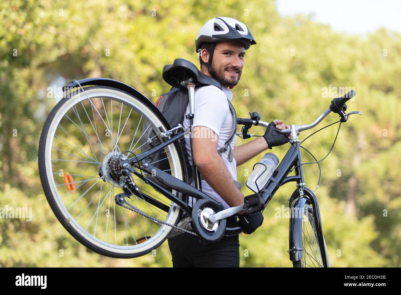 male cyclist carrying his bicycle Stock Photo - Alamy