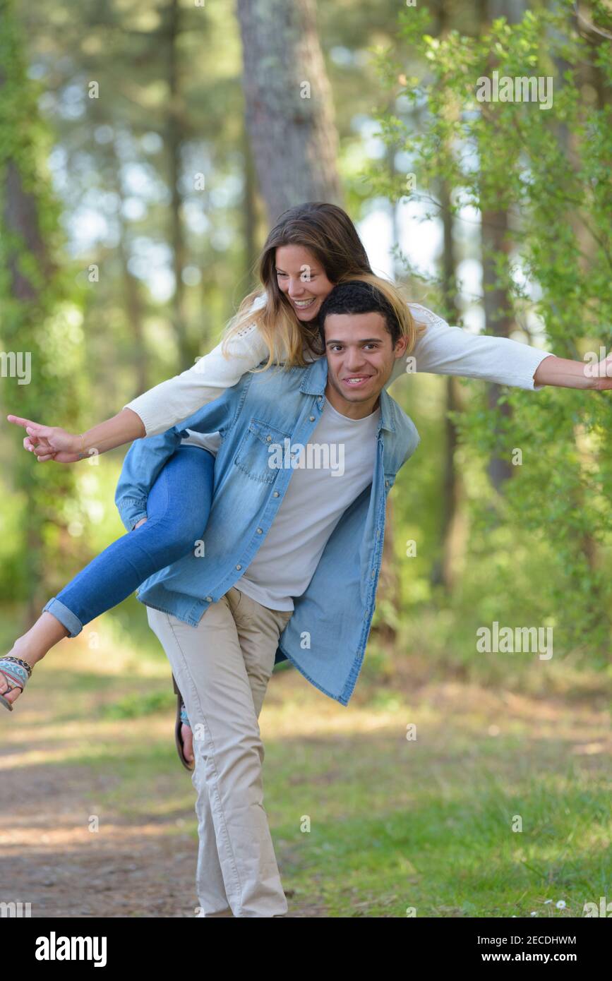 Piggy back male female laughing hugging hi-res stock photography and ...