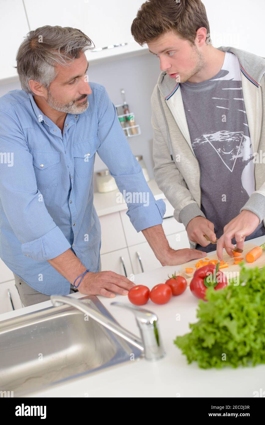 two men in the kitchen Stock Photo - Alamy