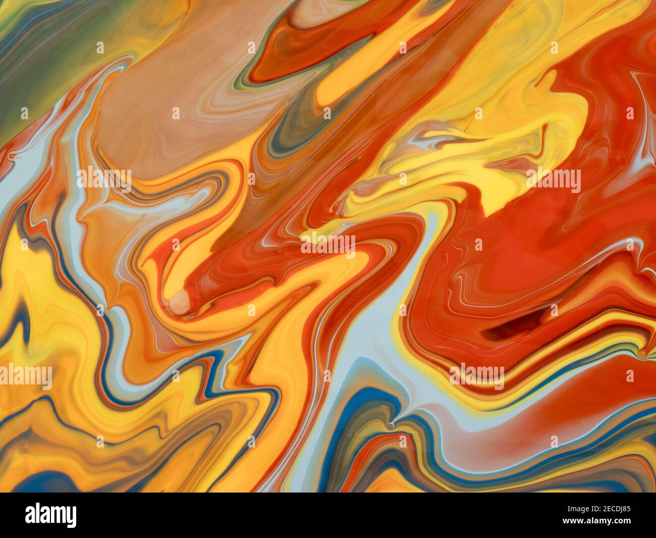 Abstract image of various colors of acrylic paint mixed together using ...