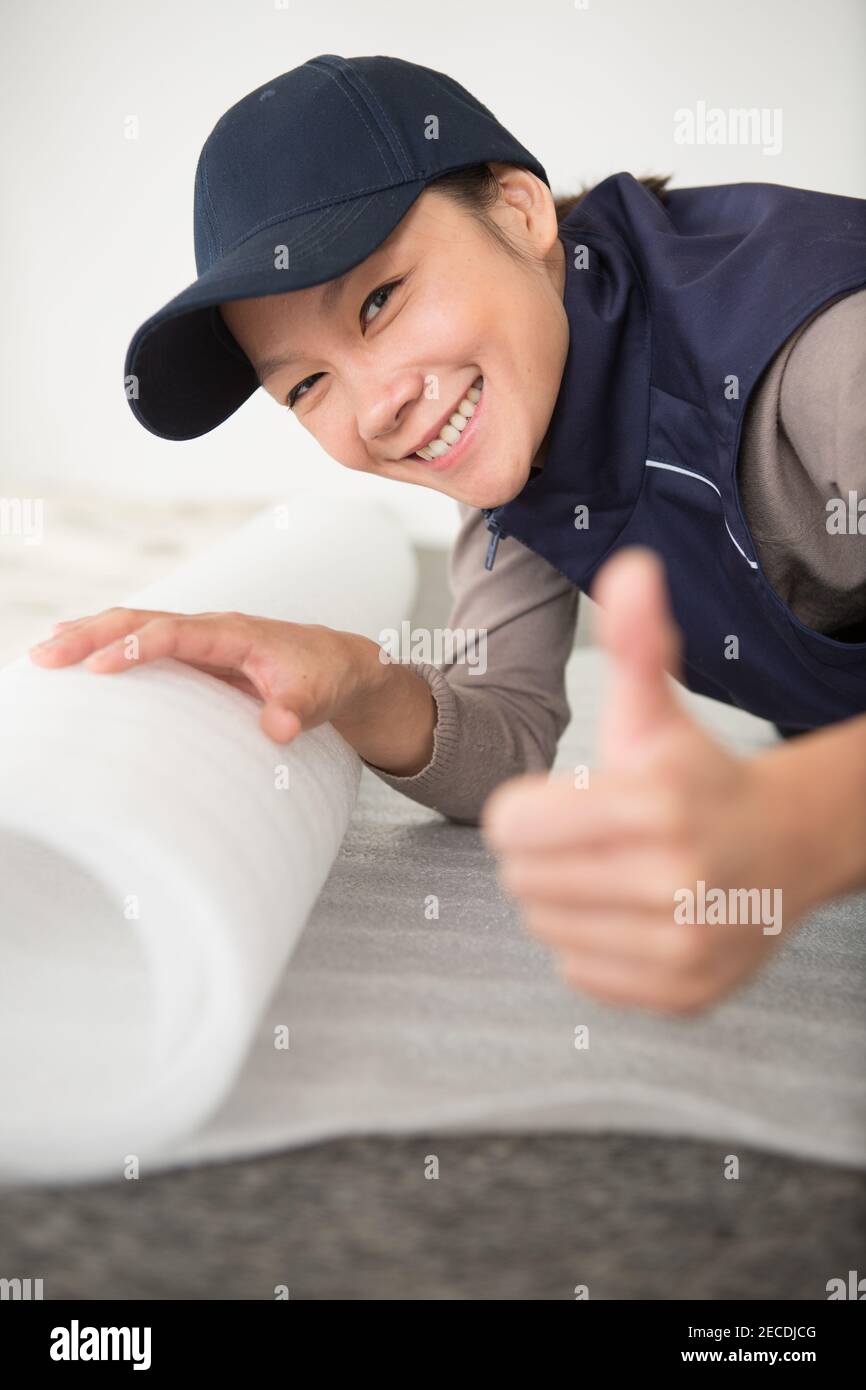 professional female cleaner showing thumb up Stock Photo - Alamy
