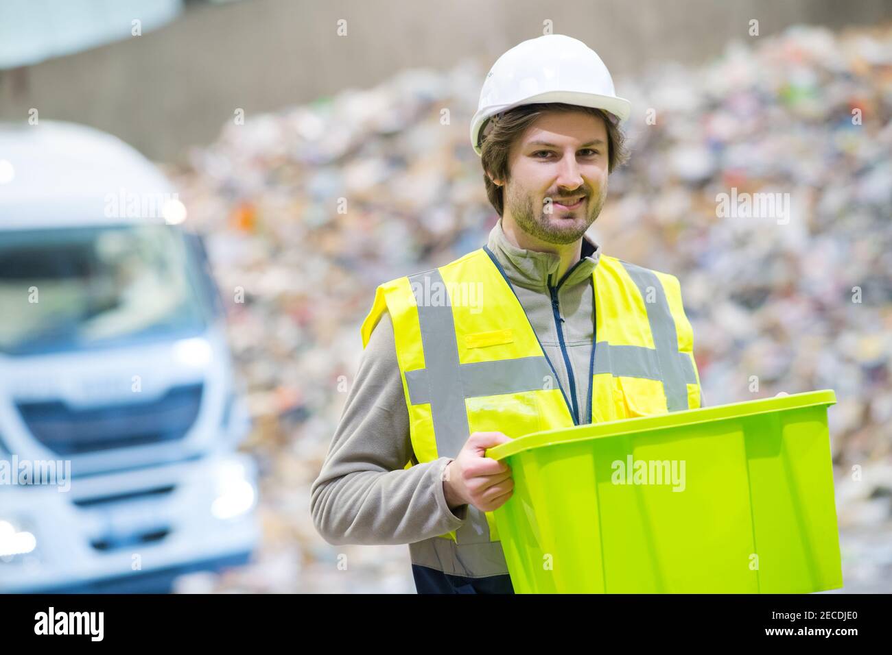 sanitation worker working in recycling plant Stock Photo - Alamy