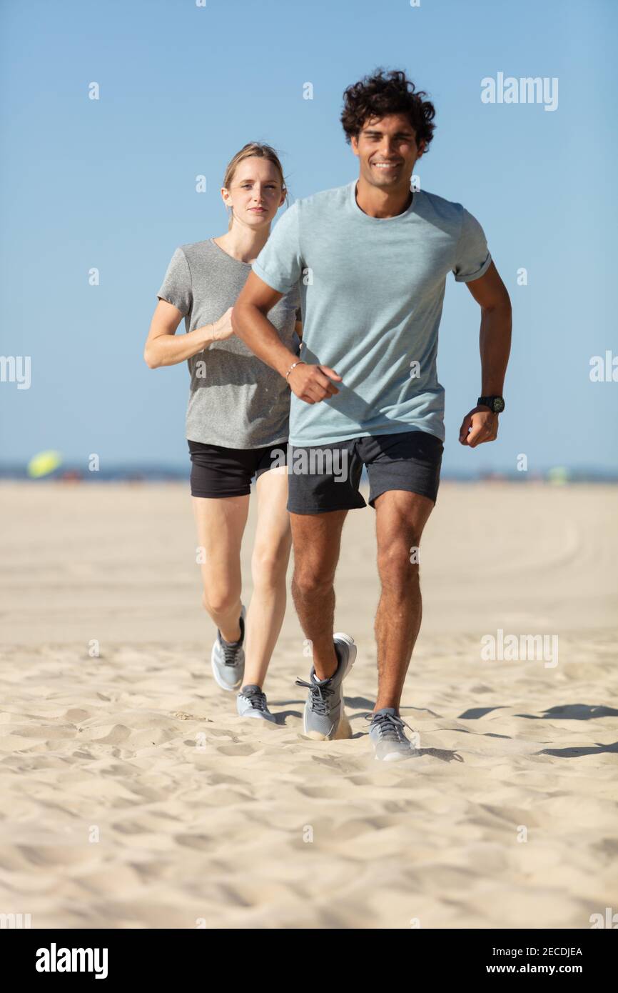 Hawaii couple running on beach hi-res stock photography and images - Alamy