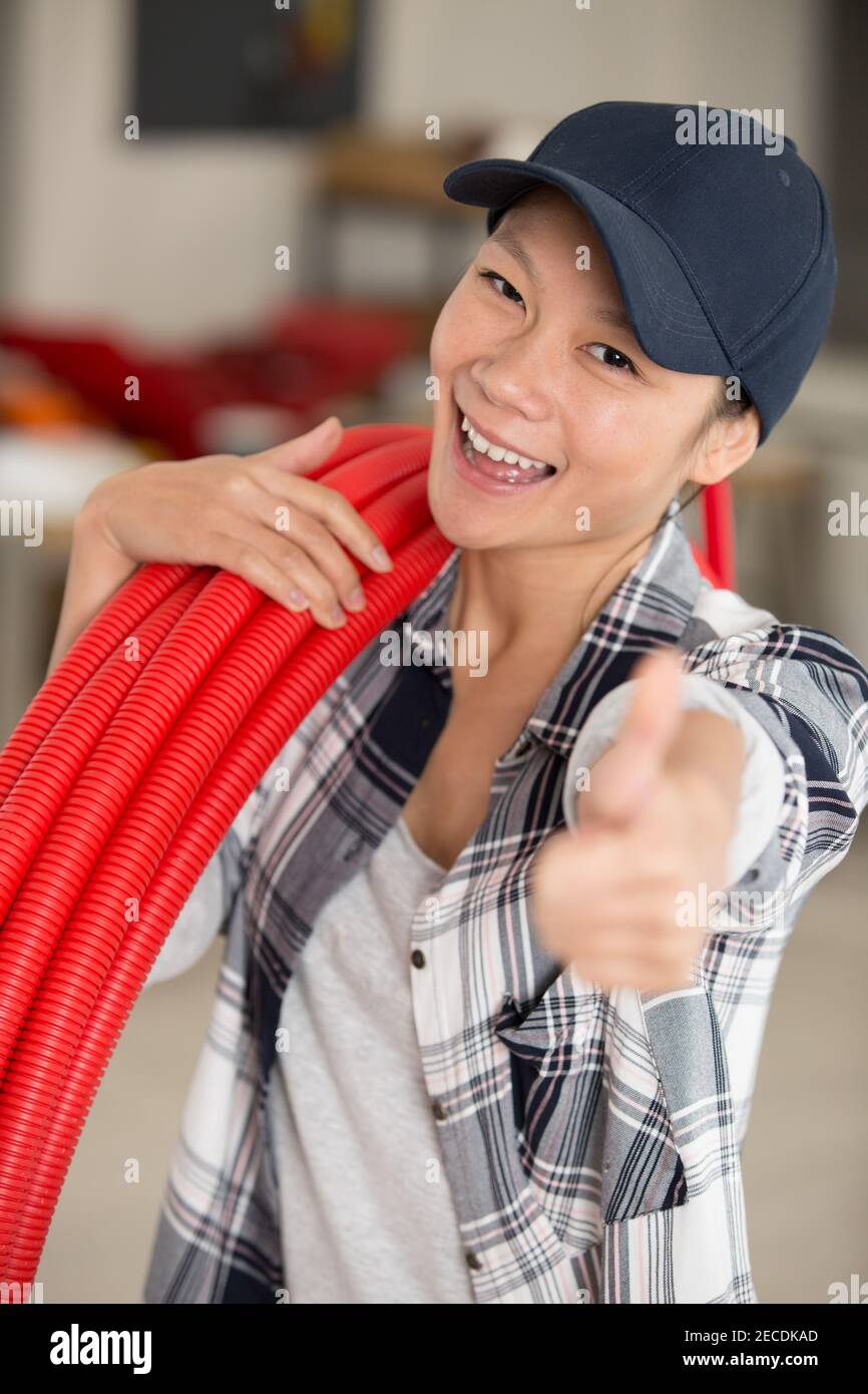 Carrying pipes on shoulder hi-res stock photography and images - Alamy