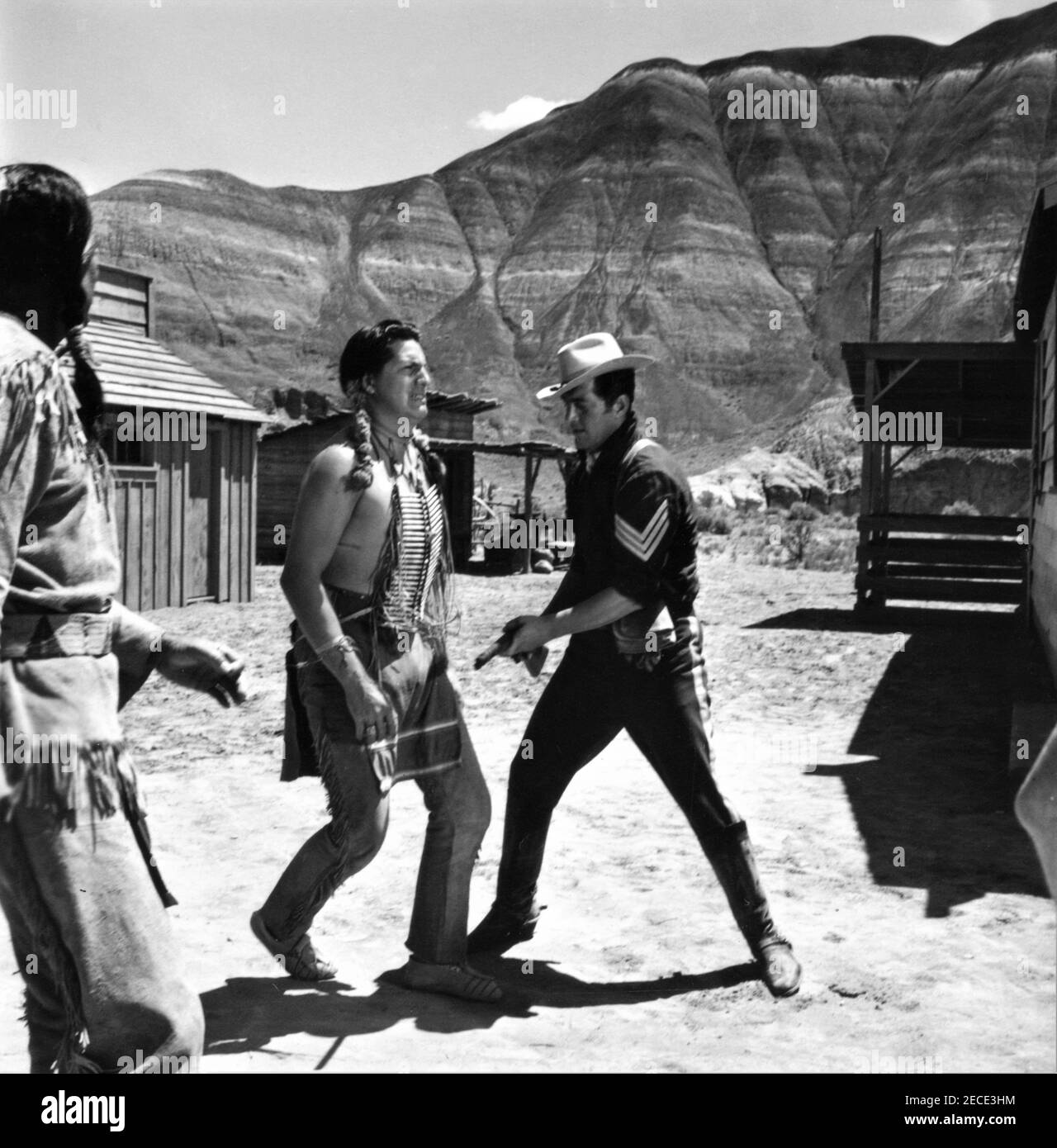 DEAN MARTIN rehearses a fight scene with Native American Indian on set ...