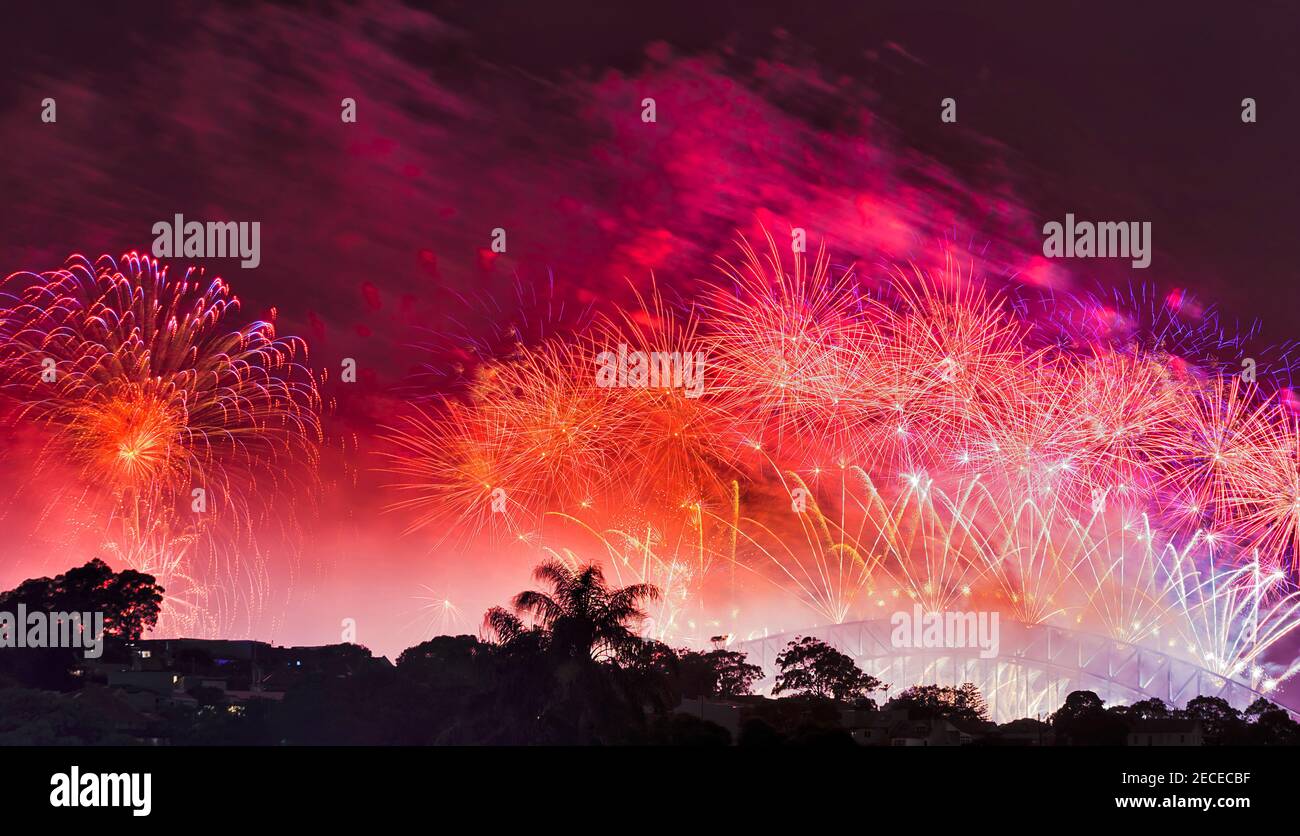 REd fire balls above Sydney Harbour bridge at New Year fireworks event ...