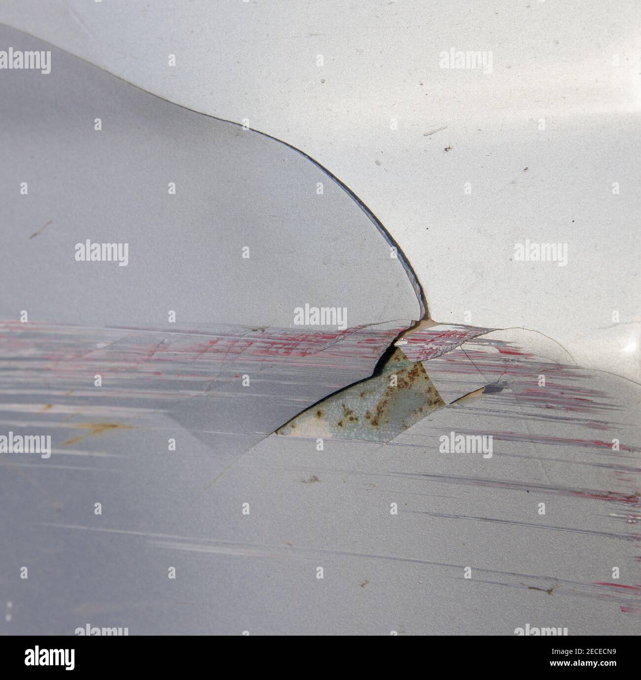 damaged paintwork on the rear of the car, initial stage of wing ...
