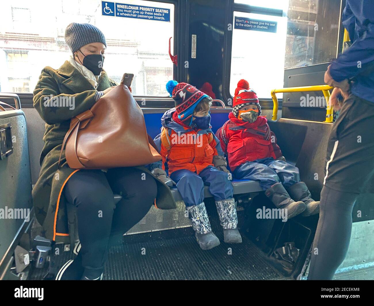 Family rides a city bus during the Covid-19 pandemic in Brooklyn, New ...