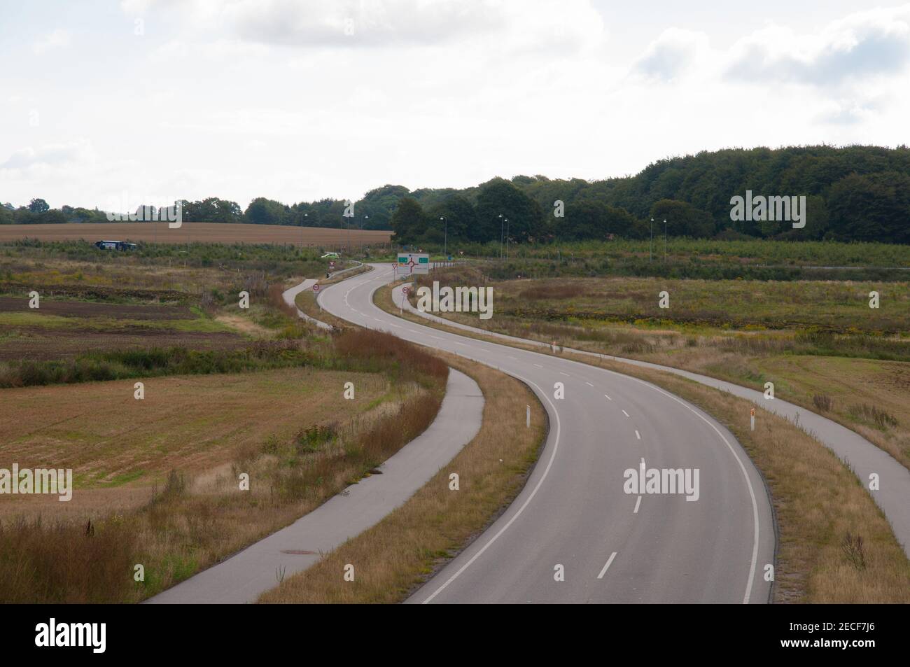 Road with bike path in Denmark Stock Photo - Alamy