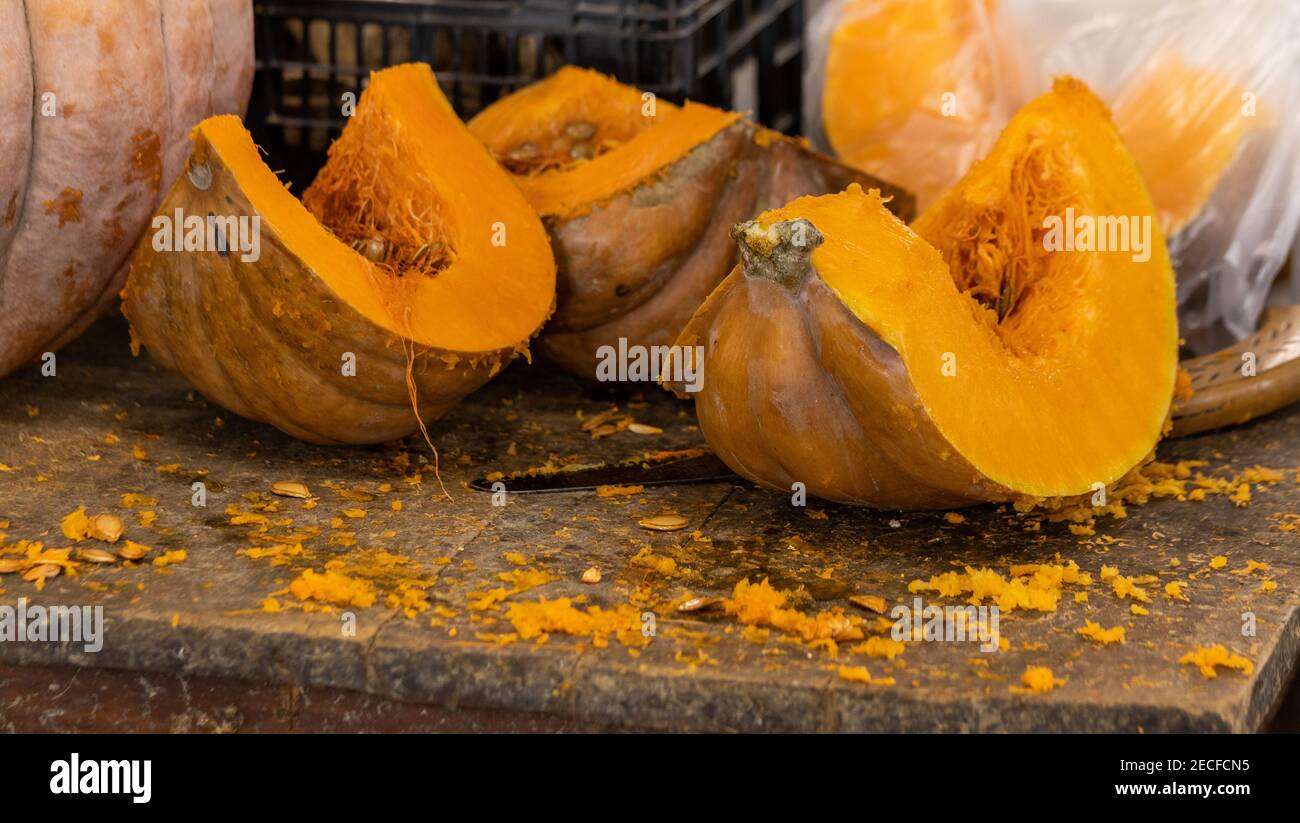 Pumpkins for sale at farmers market, fresh cut open, on display to try ...