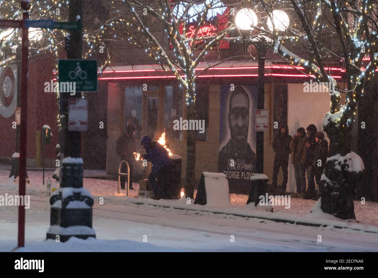 Seattle, USA. 13th Feb, 2021. Early in the morning people standing next ...