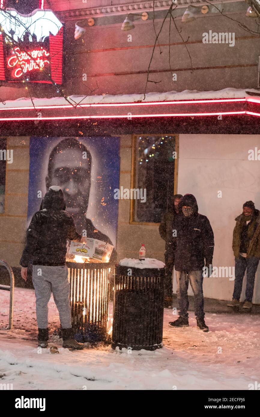 Seattle, USA. 13th Feb, 2021. Early in the morning people standing next ...