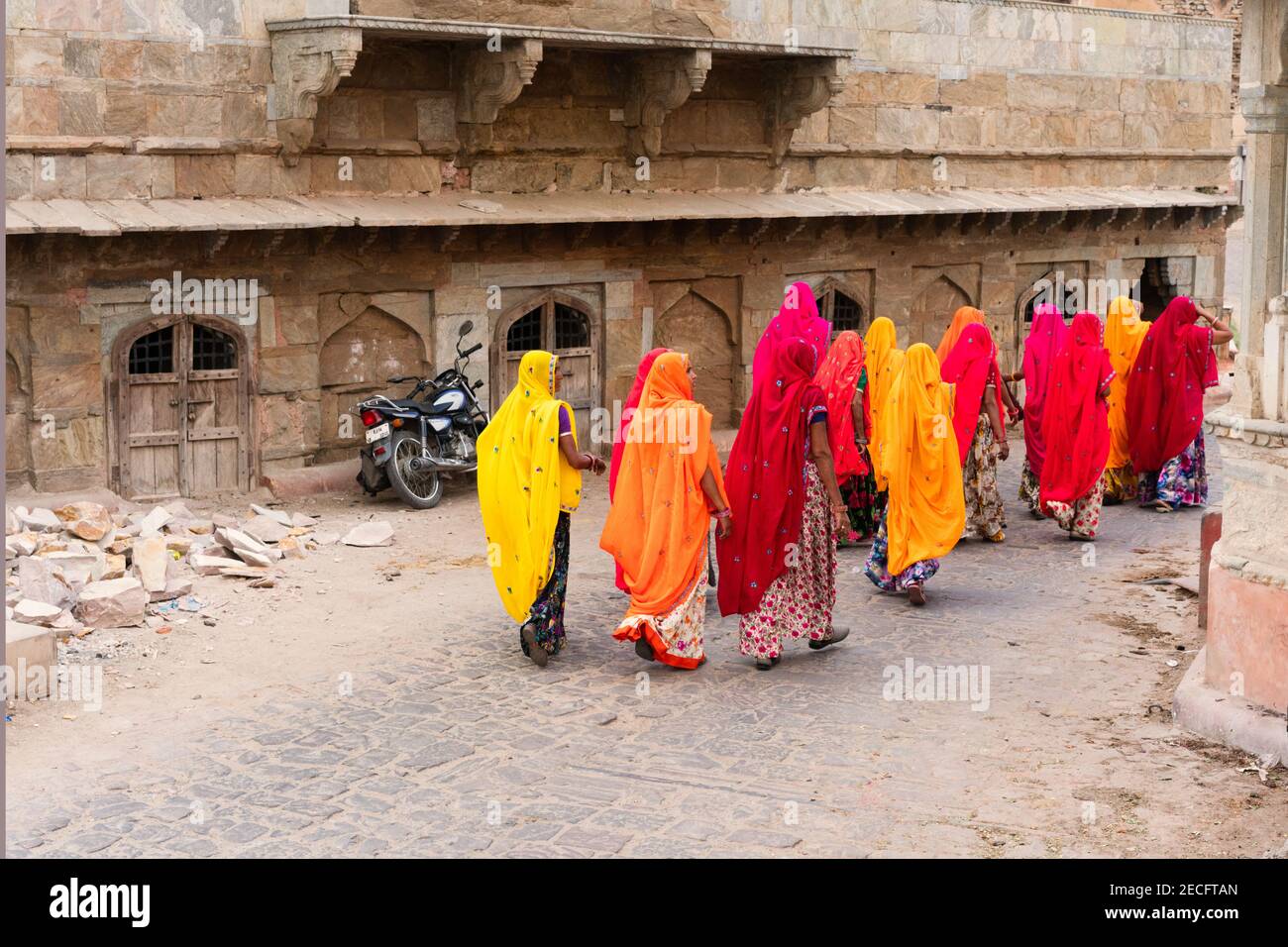 India Jaipur Women walking in a street in Jaipur in colorful veils ...