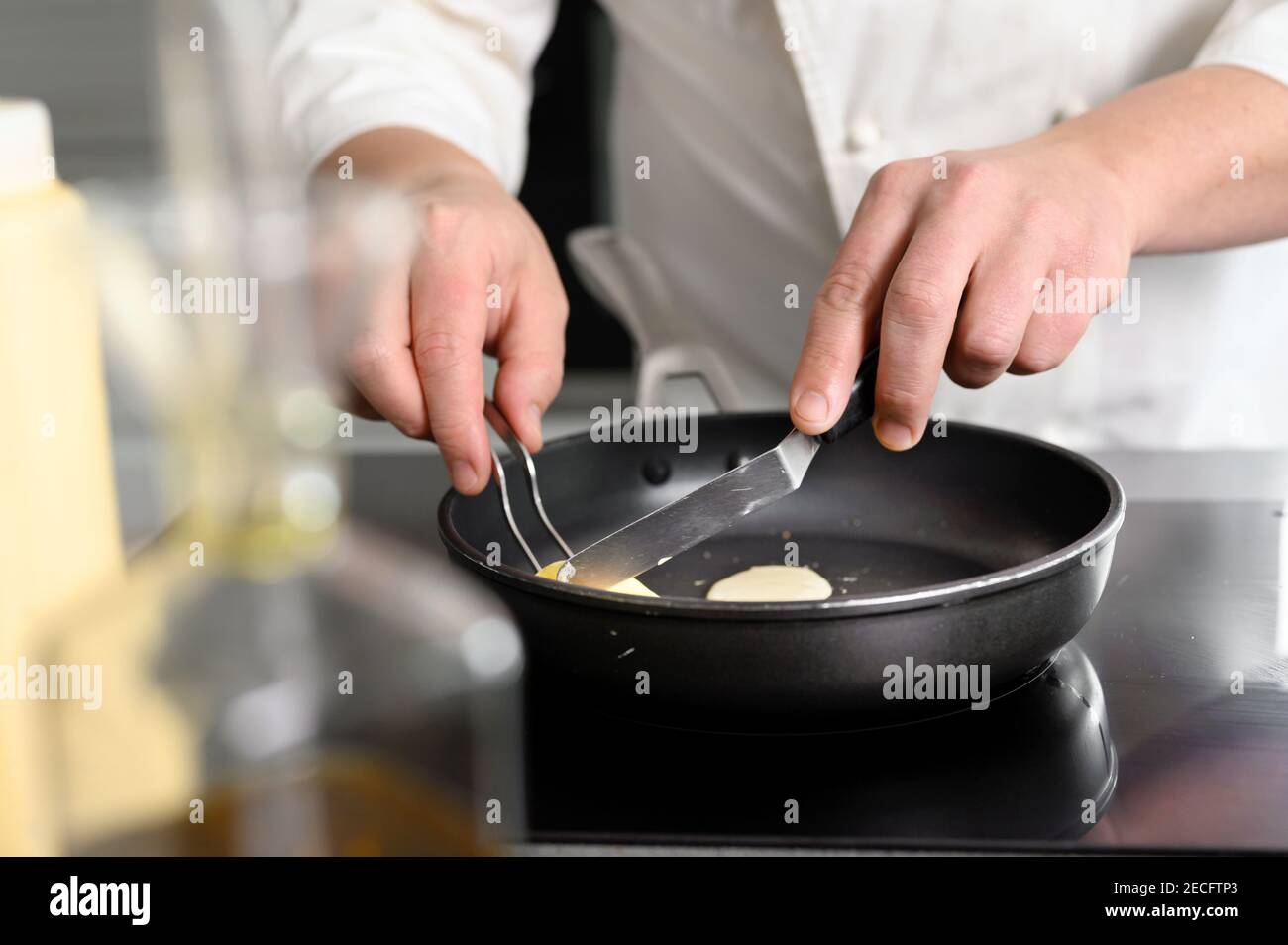 Close-up Shot, of Chef cooking in a Modern Kitchen with Lots of ...