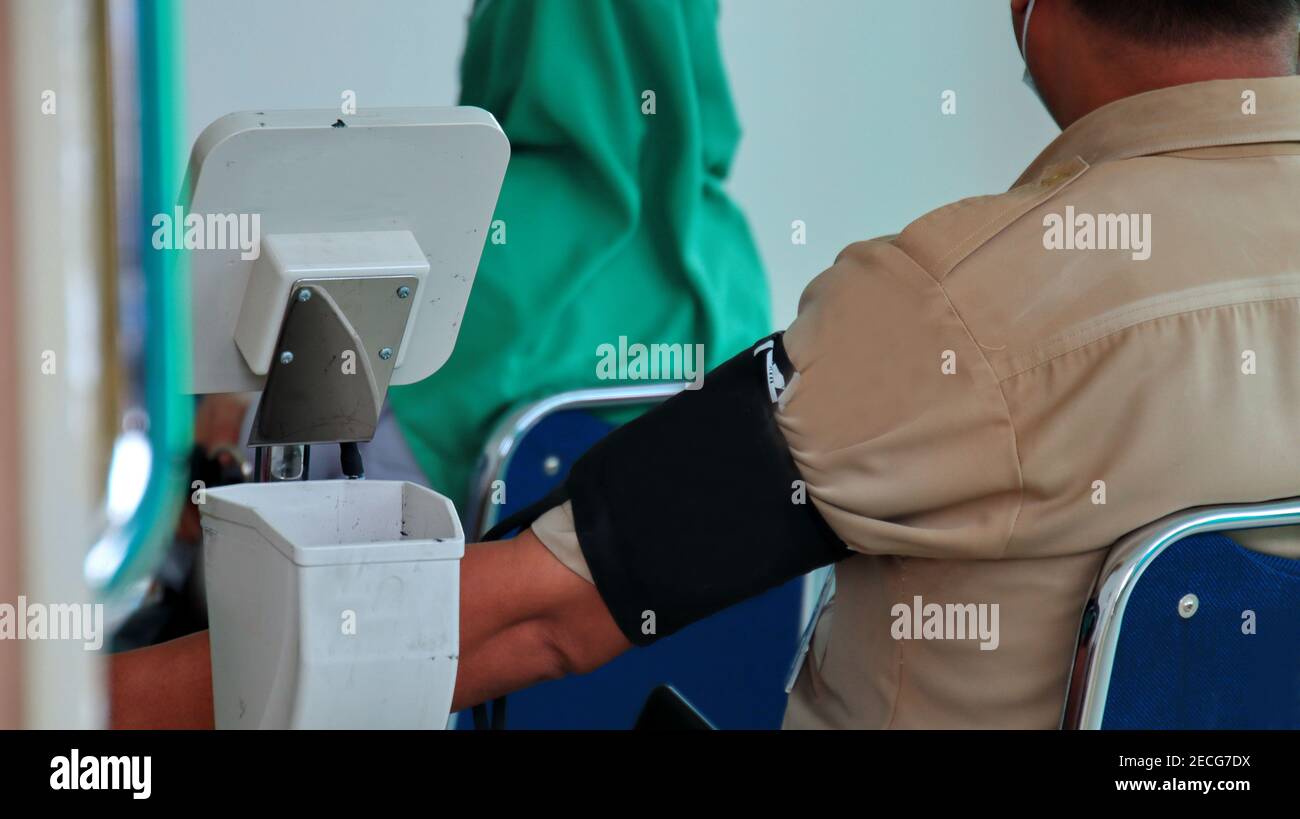 people having their health checked by a medical officer Stock Photo - Alamy