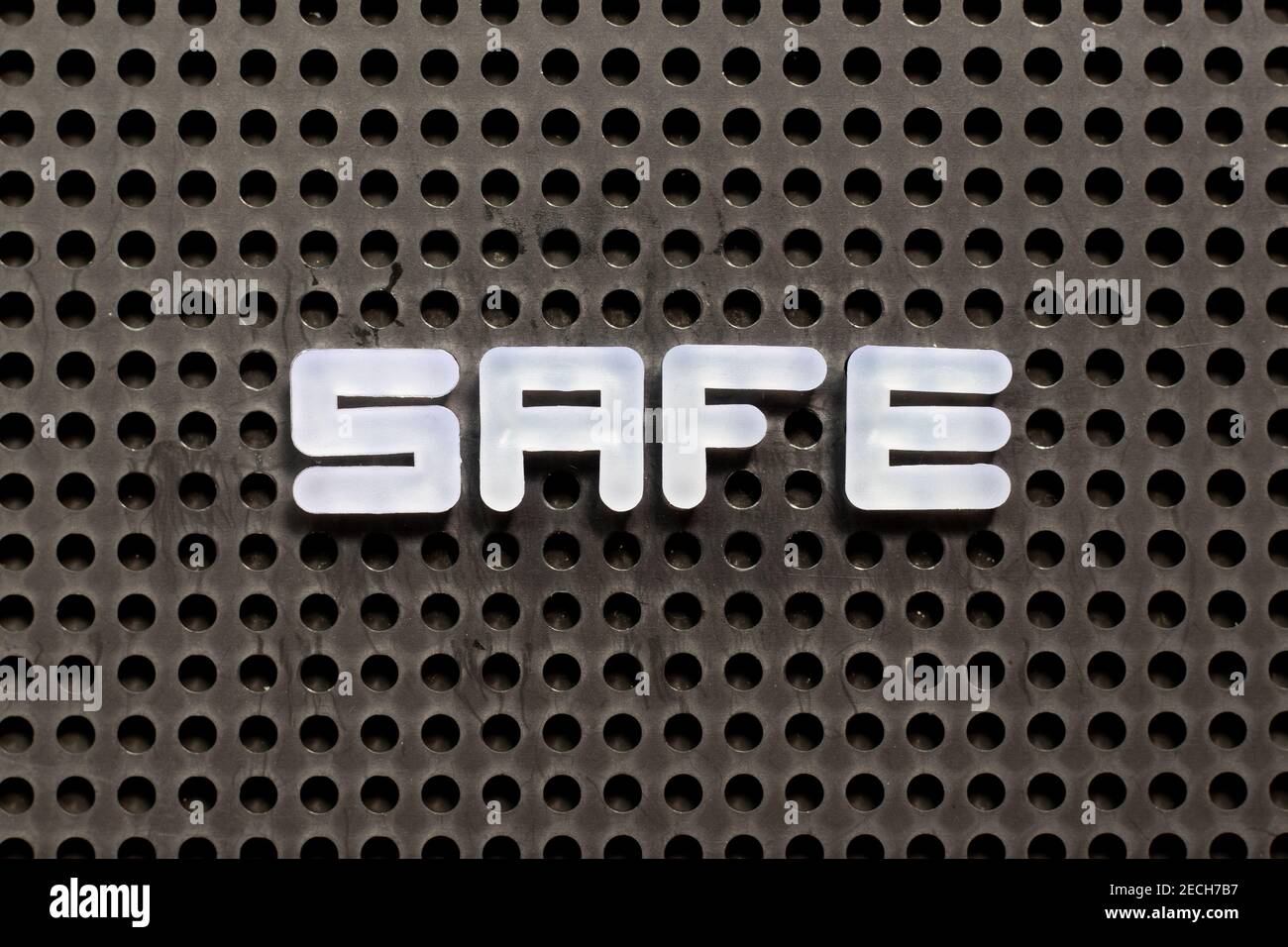 White color letter in word safe on black pegboard background Stock ...