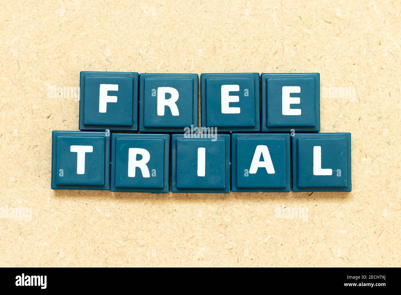 Tile alphabet letter in word free trial on wood background Stock Photo ...