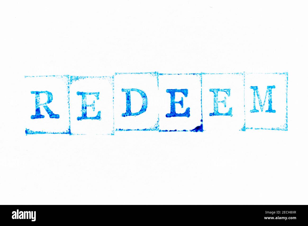Blue color ink rubber stamp in word redeem on white paper background ...