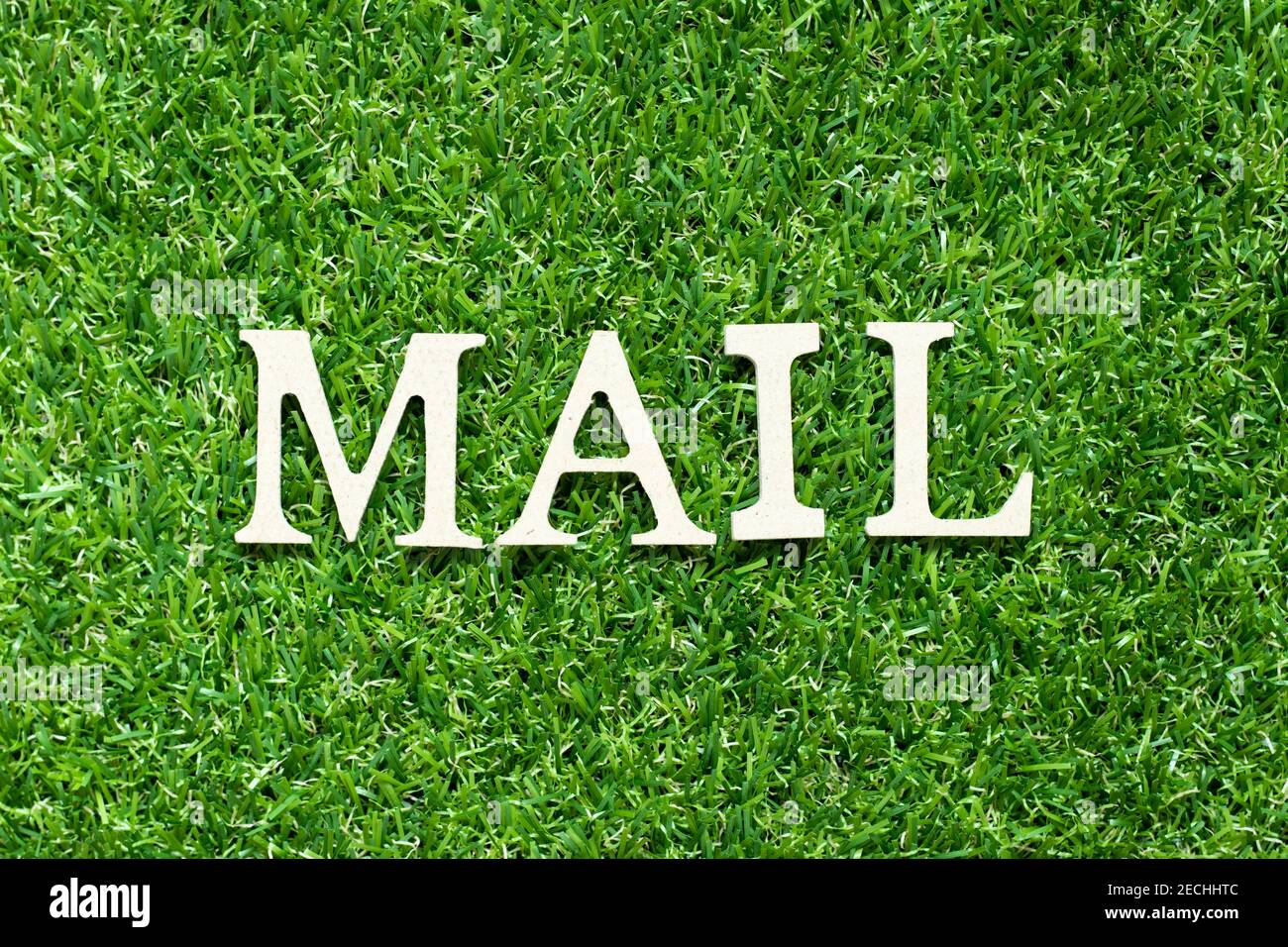 Alphabet letter in word mail on green grass background Stock Photo - Alamy