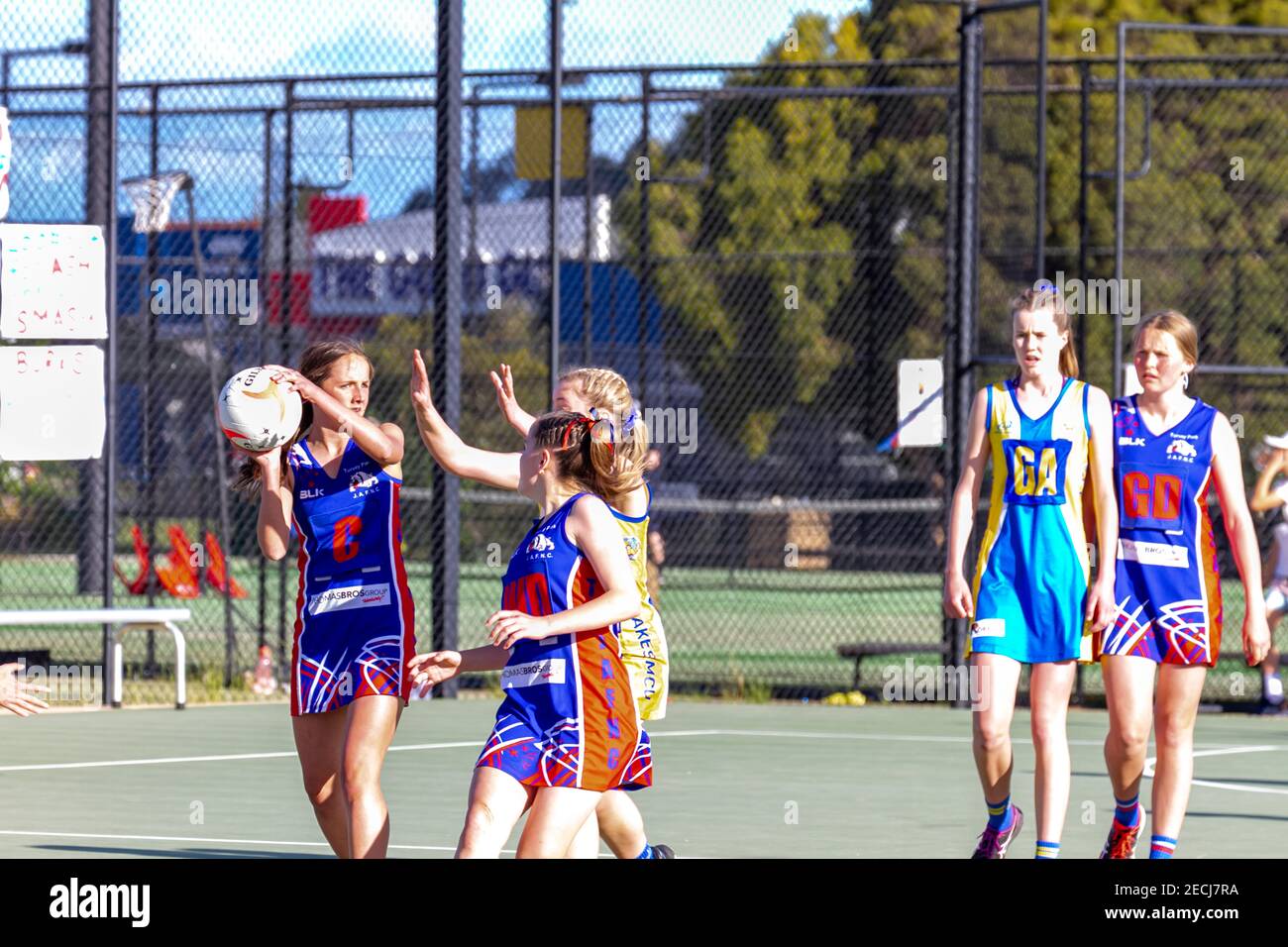 Teenage girls playing netball Stock Photo - Alamy