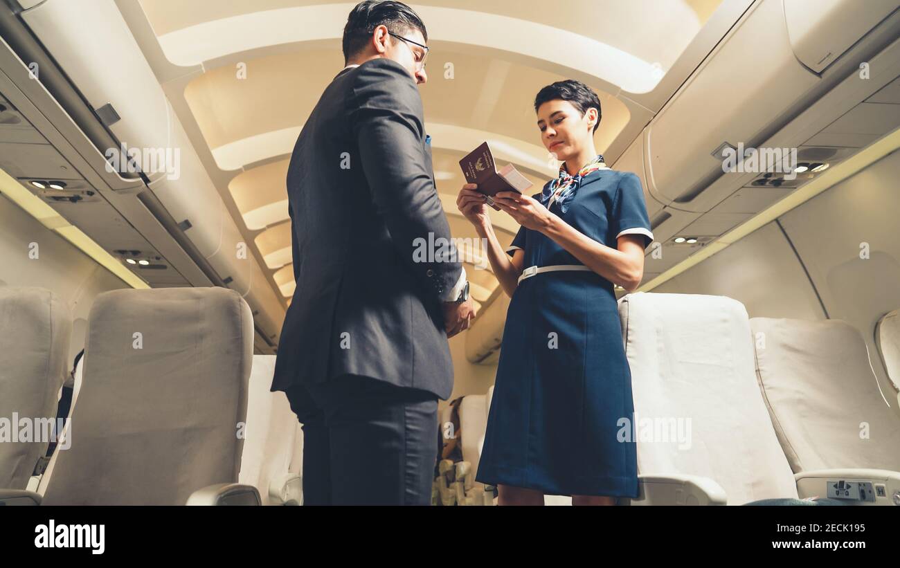 Flight attendant passenger welcome hi-res stock photography and images ...