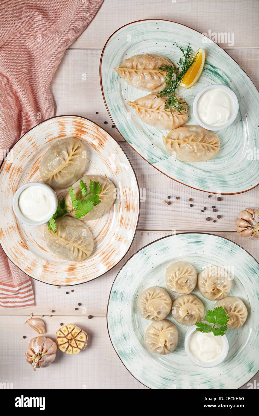 Georgian homemade food called khinkali and manti on plates Stock Photo ...