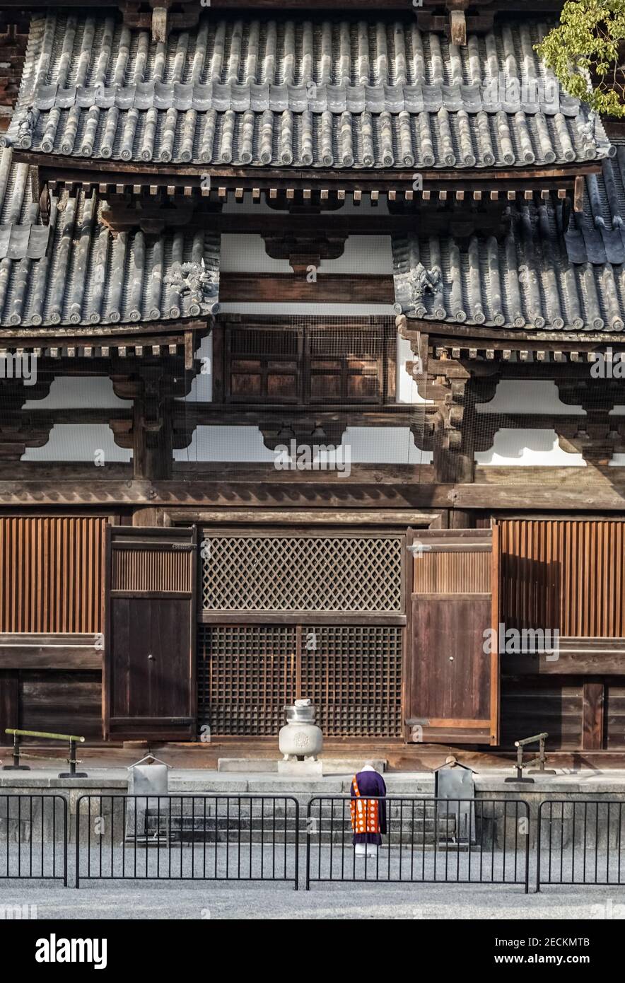 Abbot Buddhist monk praying in front of the golden hall (Kondo) of Toji ...