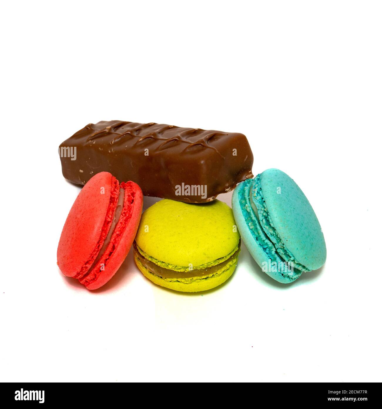 Milk chocolate bar and colored macaroons isolated on white background ...