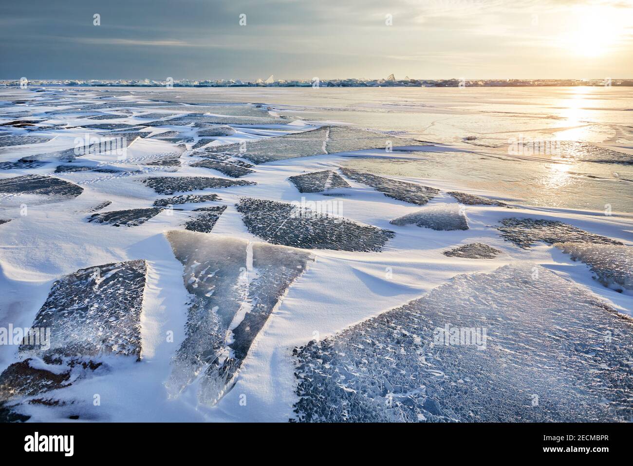 Beautiful landscape of Ice hummock and cracks at frozen lake Baikal ...