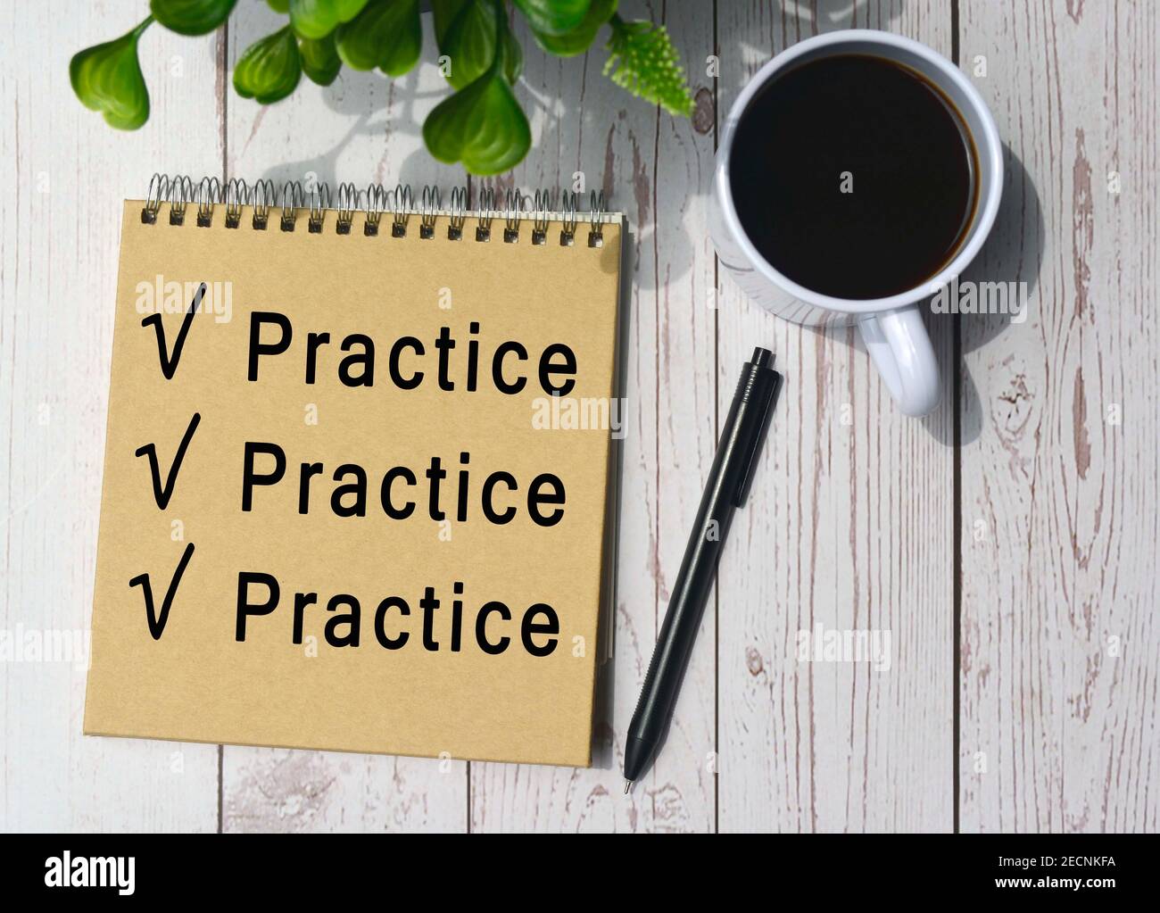 Text written on notebook with cup of coffee and pen on wooden ...
