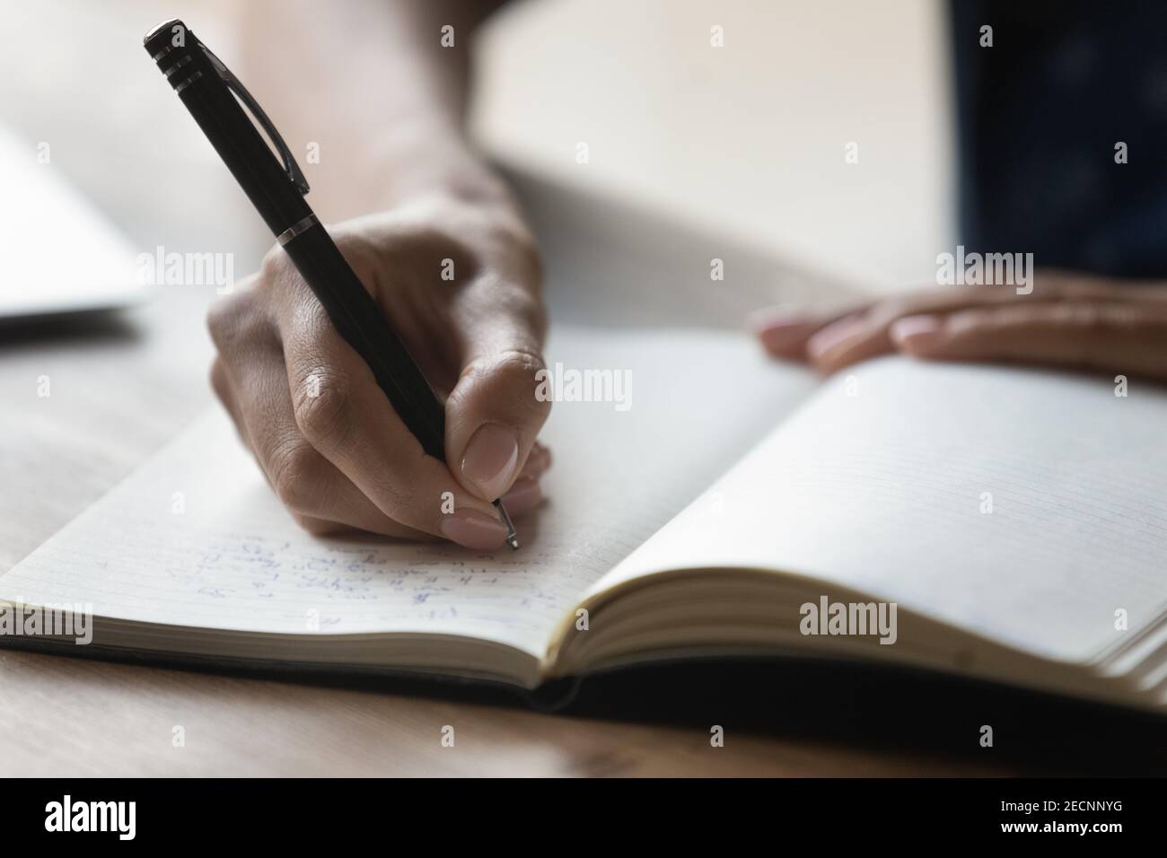 Close up African American woman taking notes, writing in notebook Stock ...
