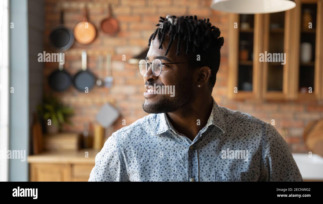 Close up smiling African American man wearing glasses dreaming Stock ...
