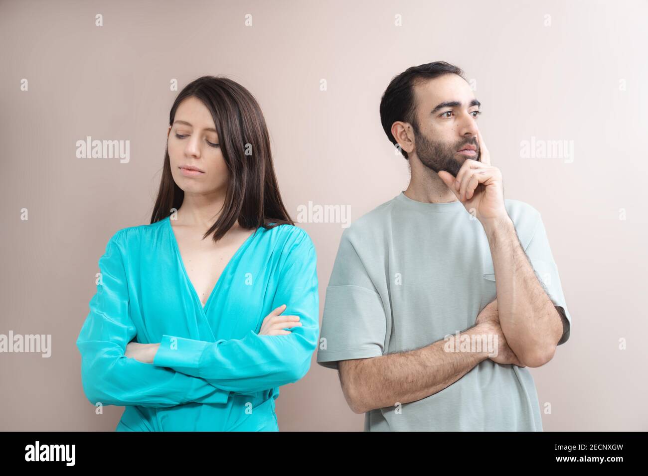 Young adult beautiful couple arguing studio portrait shot, expressing ...