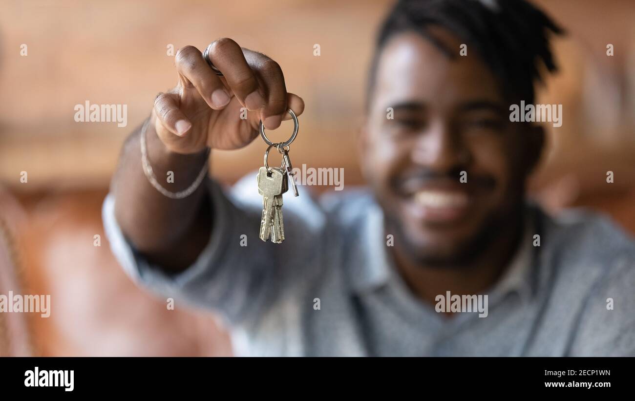 Close up satisfied African American man customer showing keys Stock ...