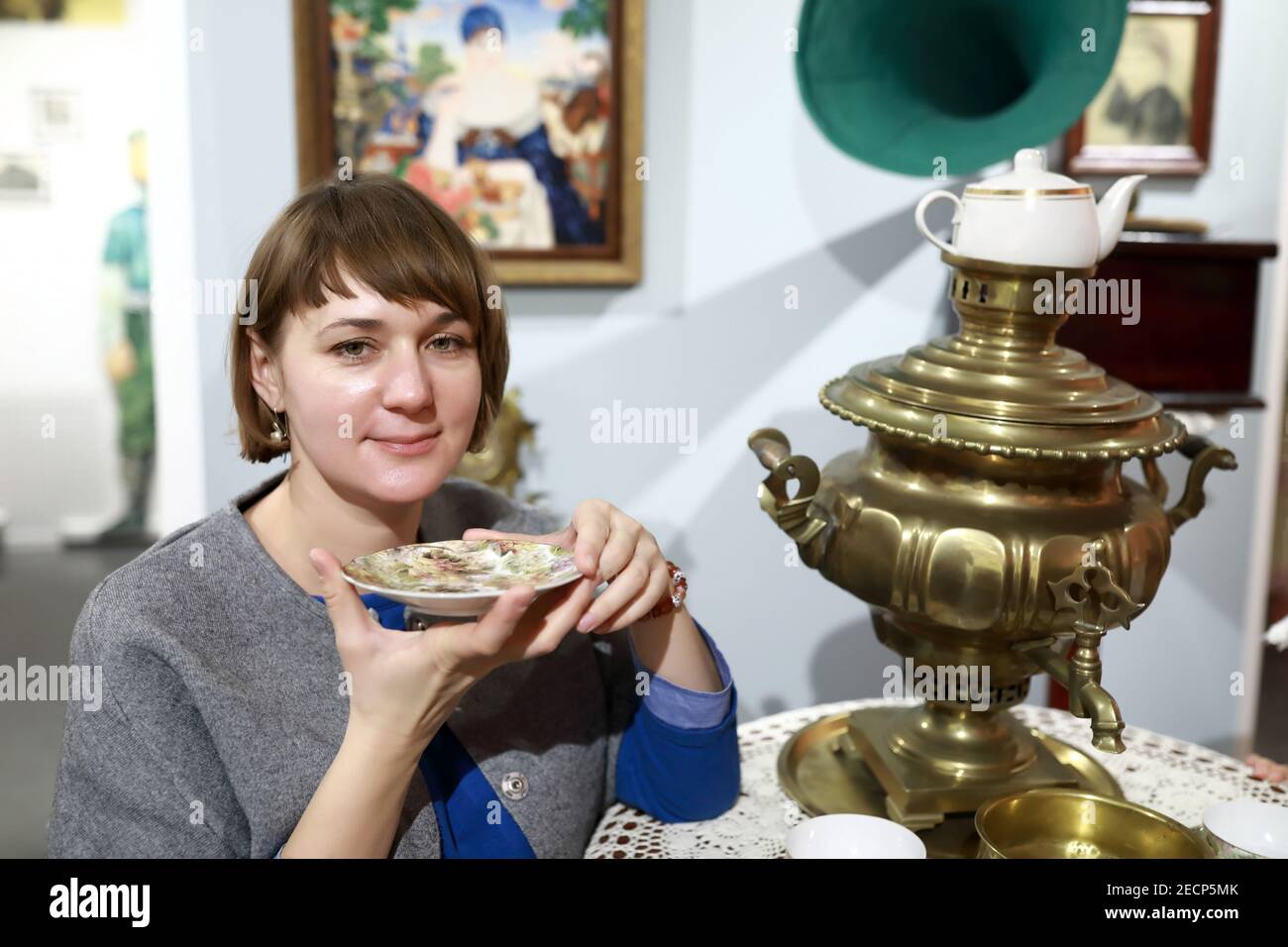 Woman drinking tea from samovar in cafe Stock Photo - Alamy