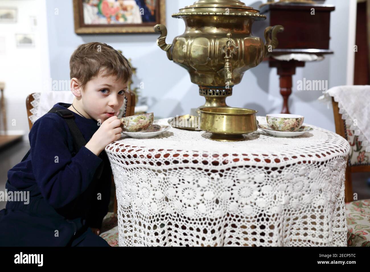 Child drinking tea from samovar in cafe Stock Photo - Alamy