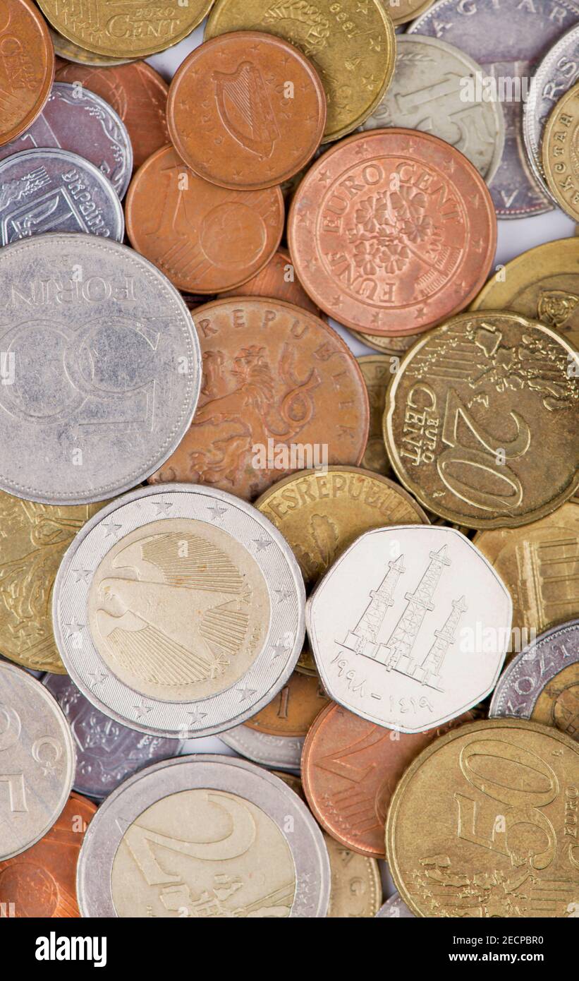 Coins of different countries on a white background Stock Photo - Alamy