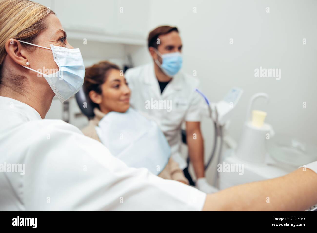 Female dentist wearing face mask hi-res stock photography and images ...