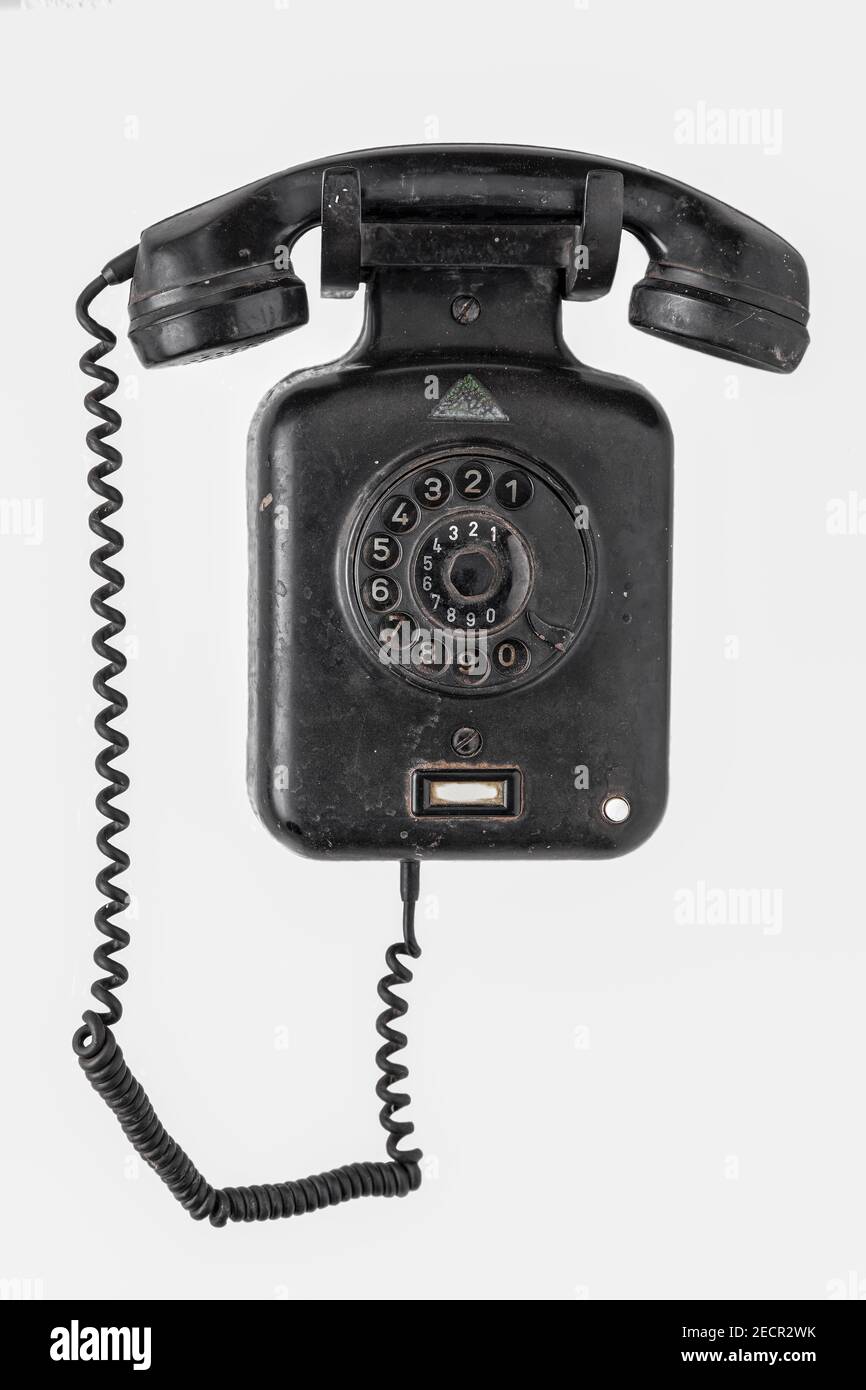Old bakelite wall phone on white background Stock Photo - Alamy