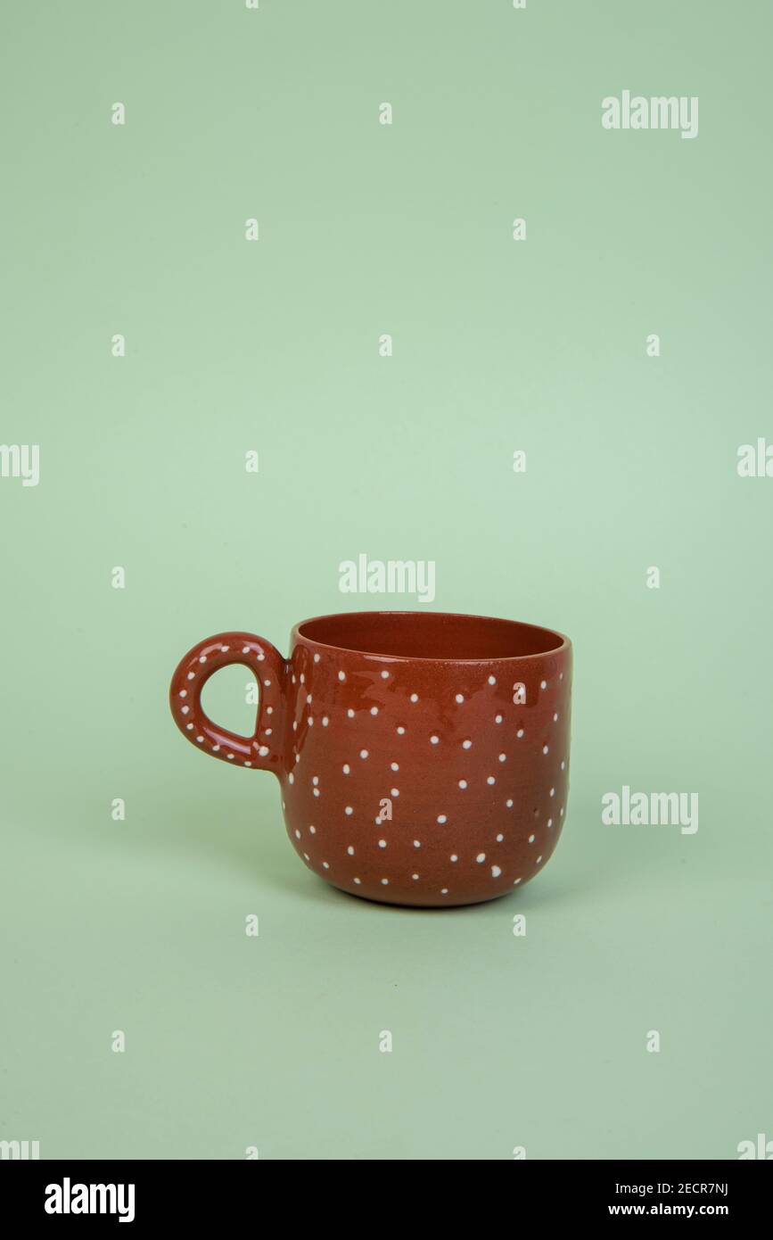 colorful handmade ceramic coffee cup isolated Stock Photo - Alamy