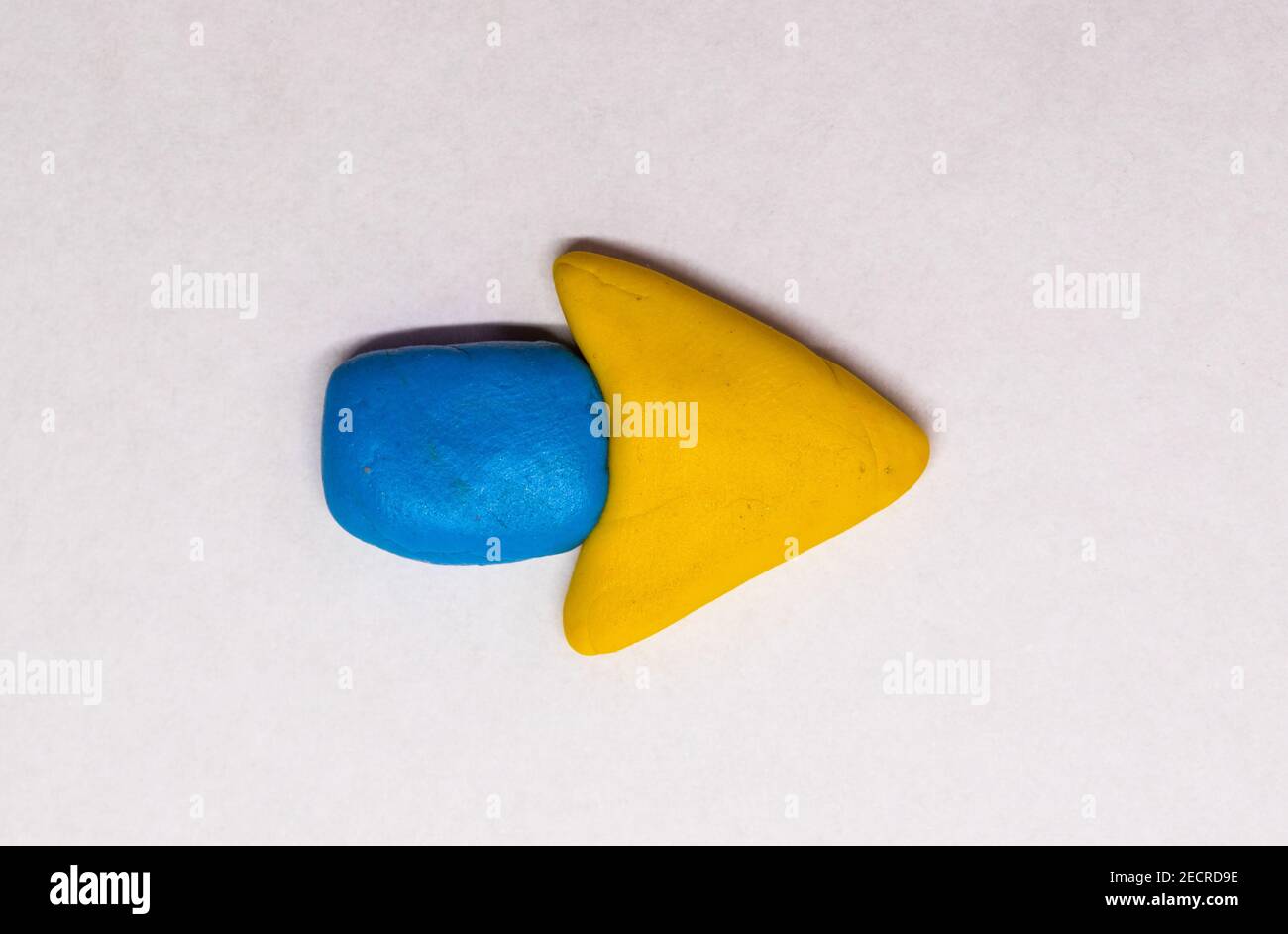 Yellow blue arrow pointer isolated. Modelling clay navigation sign on ...