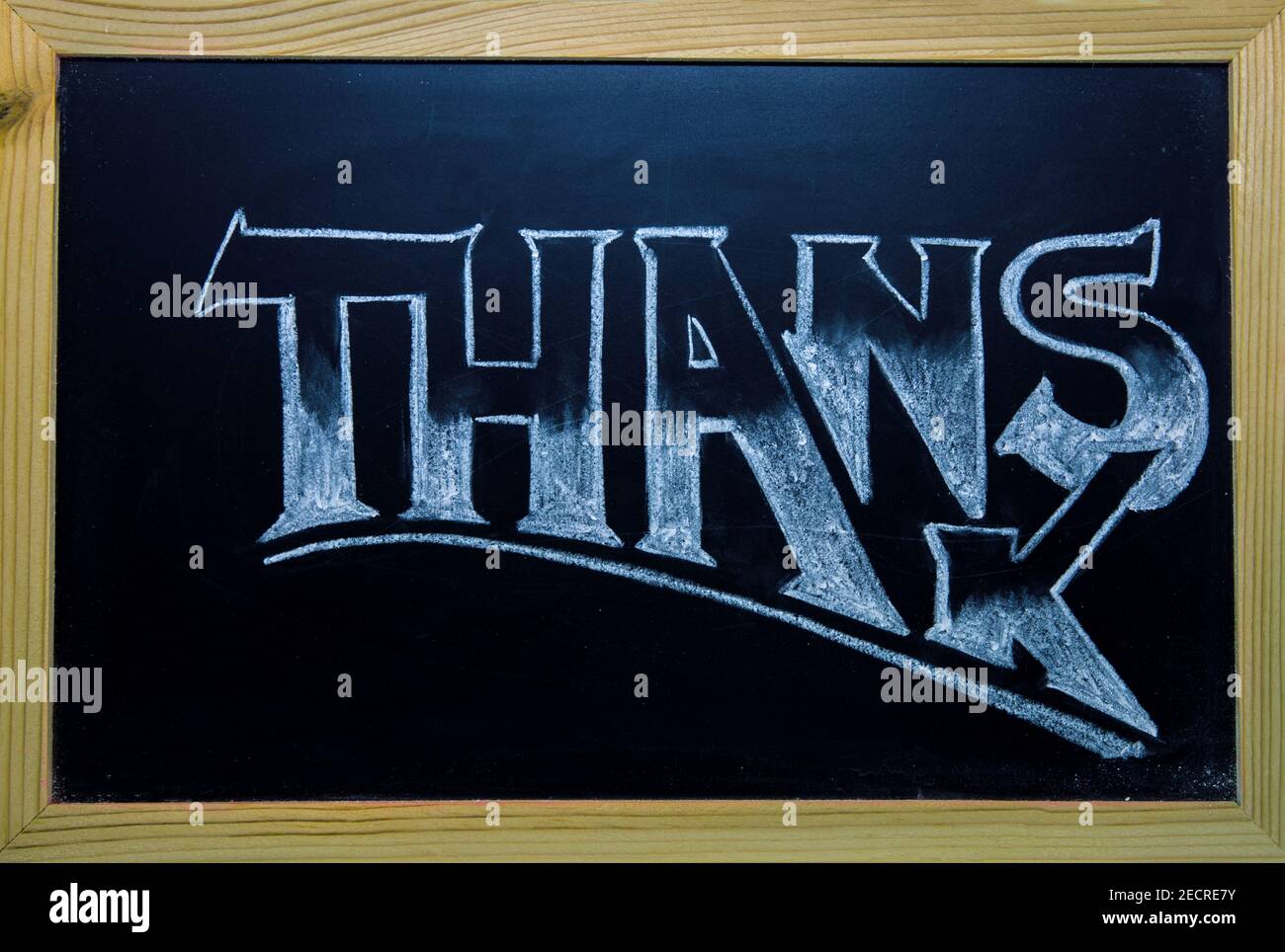 Thanks inscription by white chalk on black chalkboard. Thanks word in ...