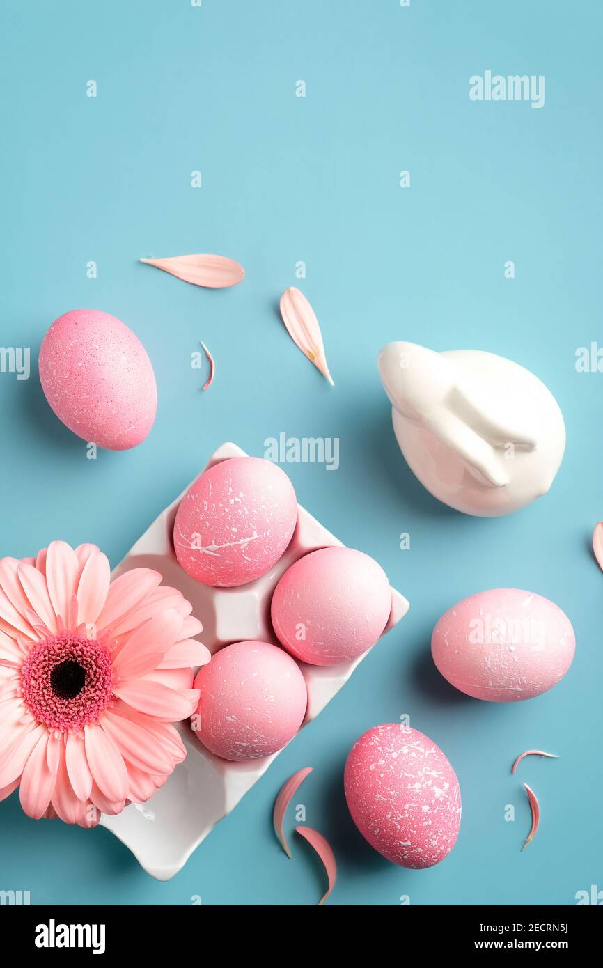 Easter flat lay composition with pink Easter eggs, spring flower ...