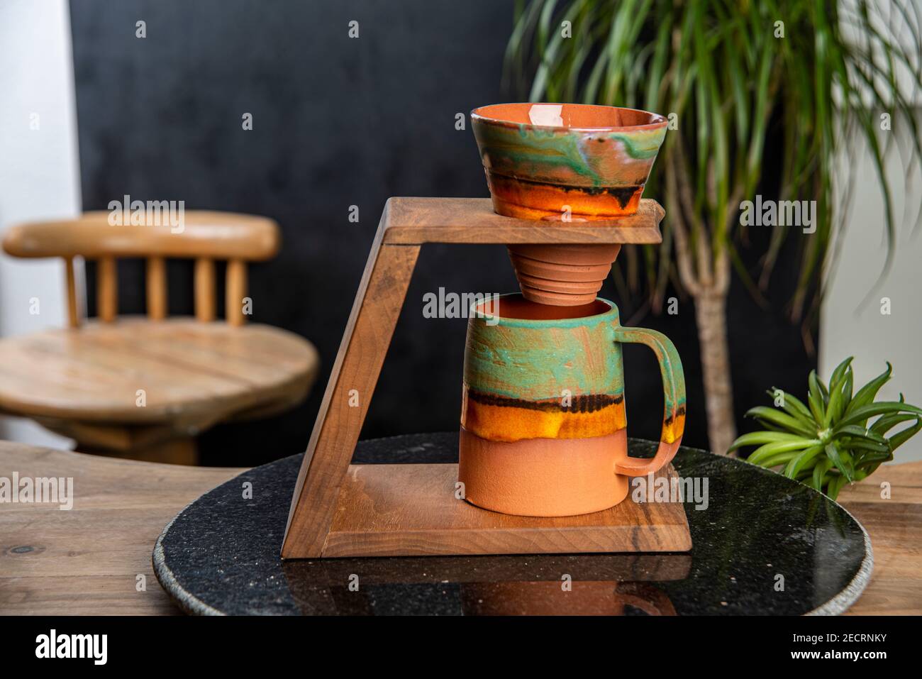 colorful handmade porcelain coffee cup with coffee drip Stock Photo - Alamy
