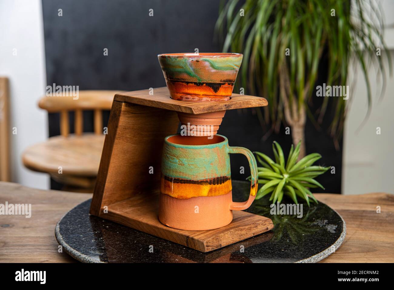 colorful handmade porcelain coffee cup with coffee drip Stock Photo - Alamy