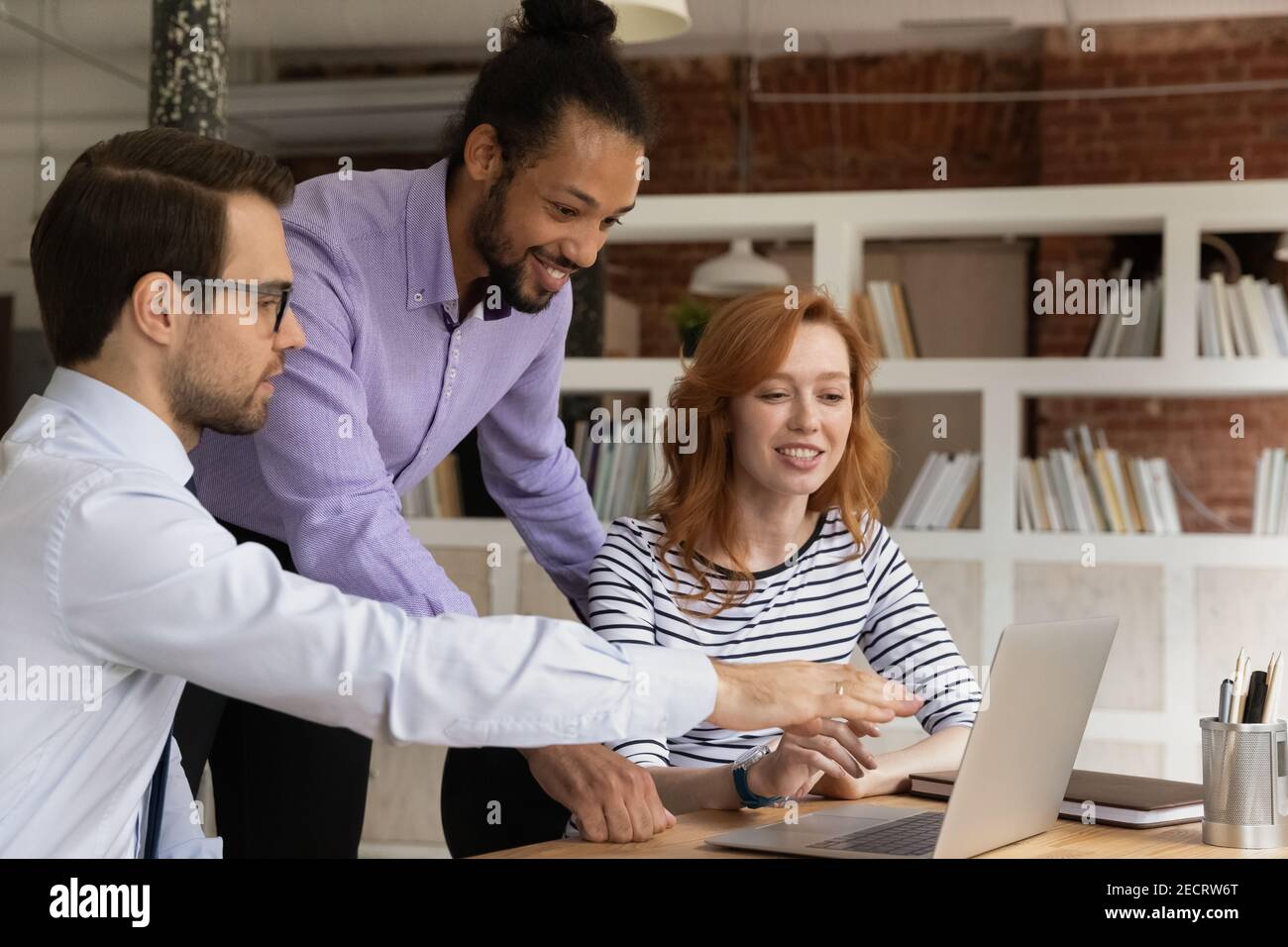 Group businesspeople look computer together hi-res stock photography ...