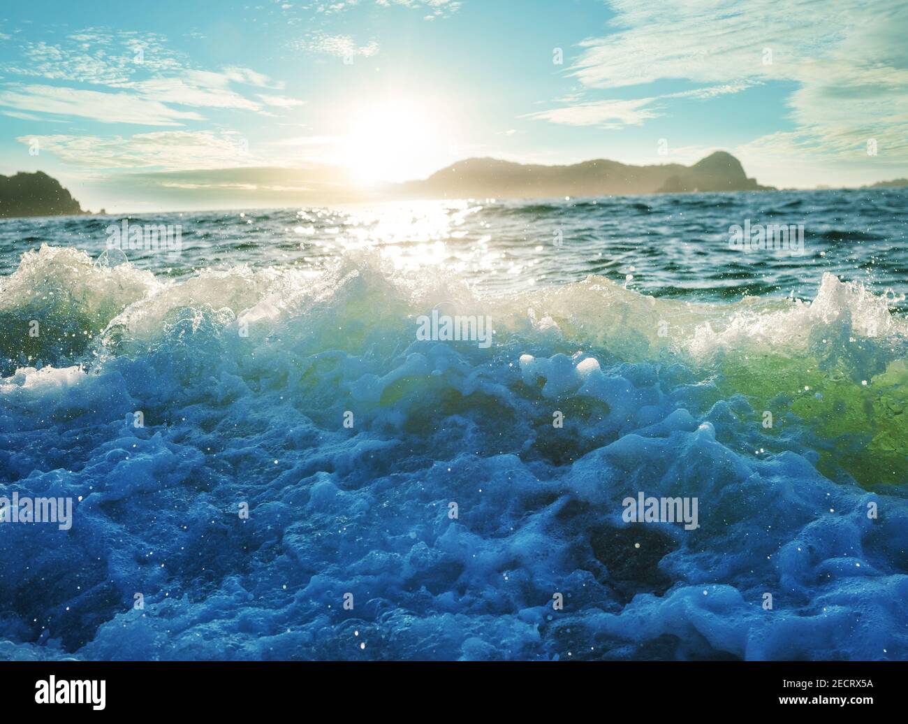 Blue wave on the beach. Blur background and sunlight spots. Dramatic ...