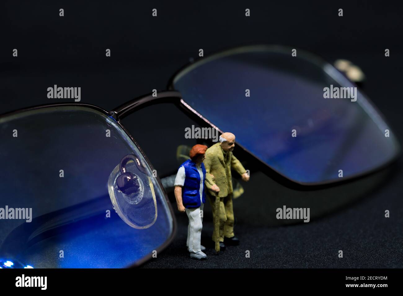 Old couple and optical glasses macro scene. Senior age couple walking ...
