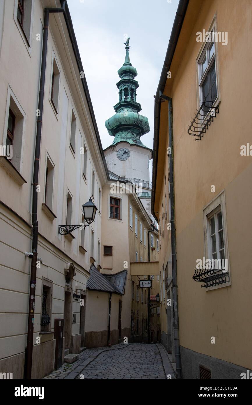 The contrasts in Old Town Bratislava, Slovakia. Devil's Strip Club sign ...