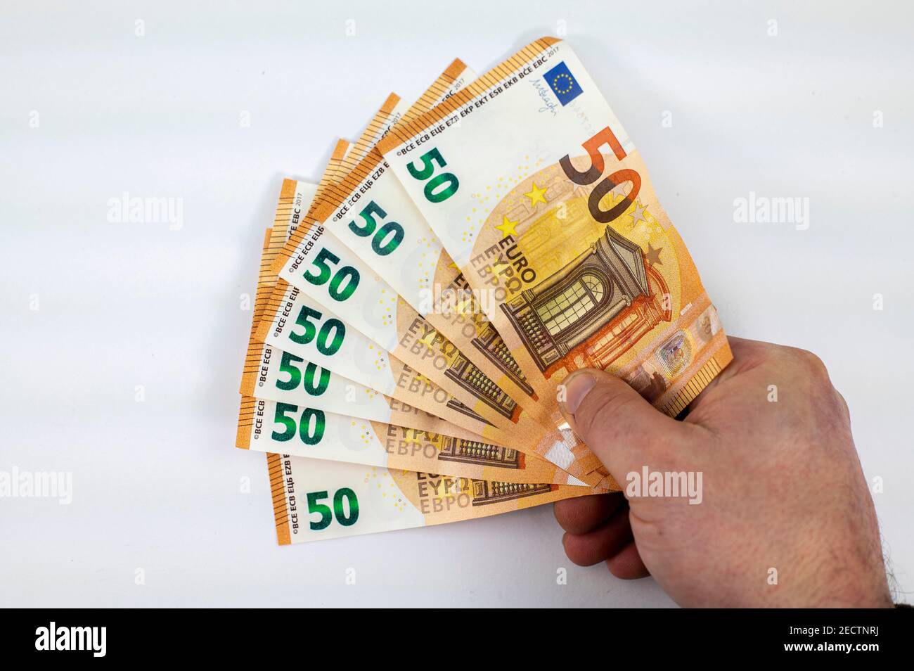 hand of man with 50 euro fan over white background Stock Photo - Alamy